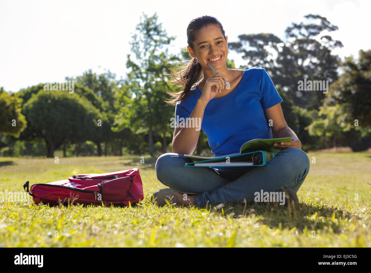 Pretty student studying outside Stock Photo - Alamy