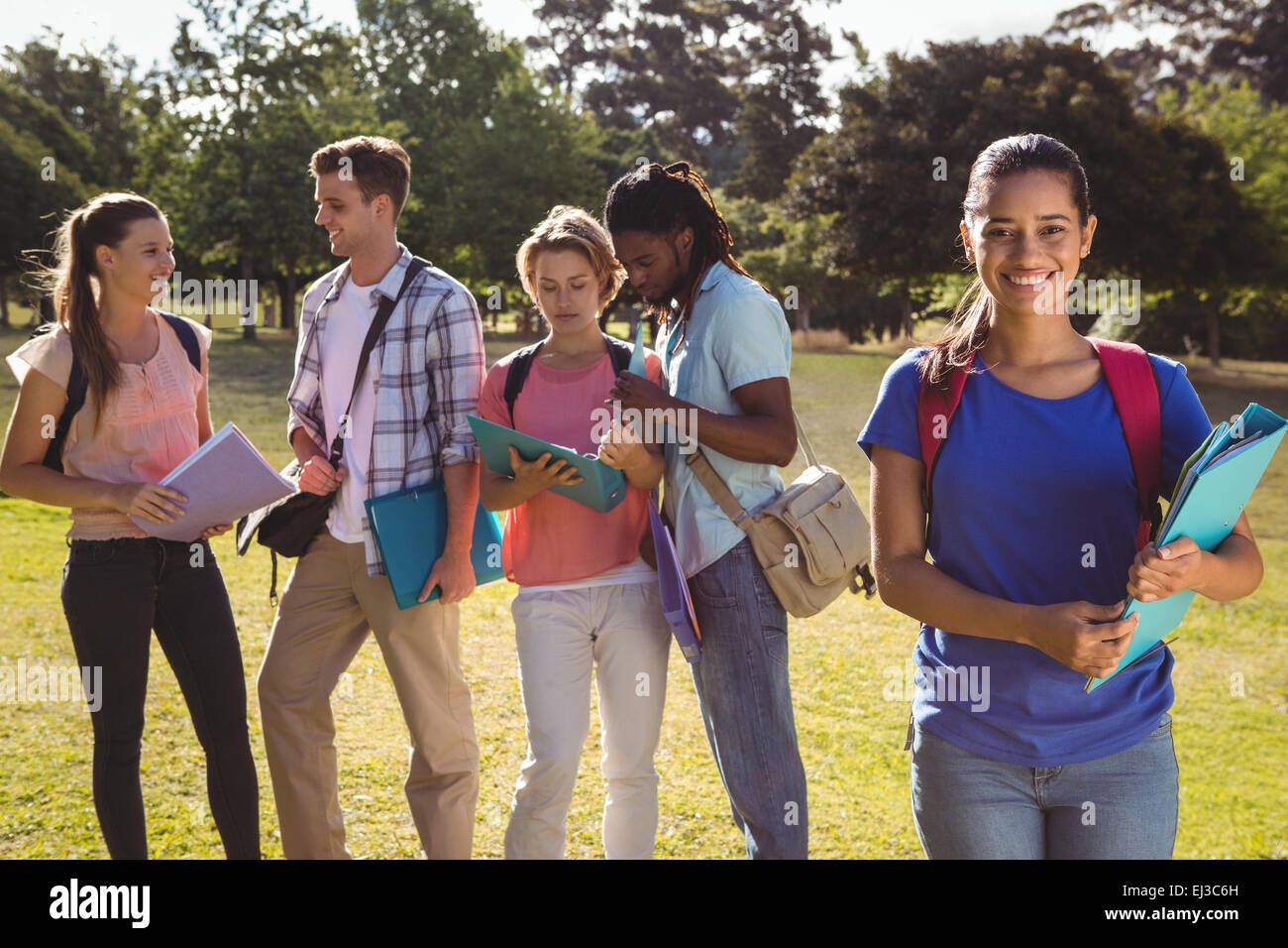 Happy students outside on campus Stock Photo - Alamy