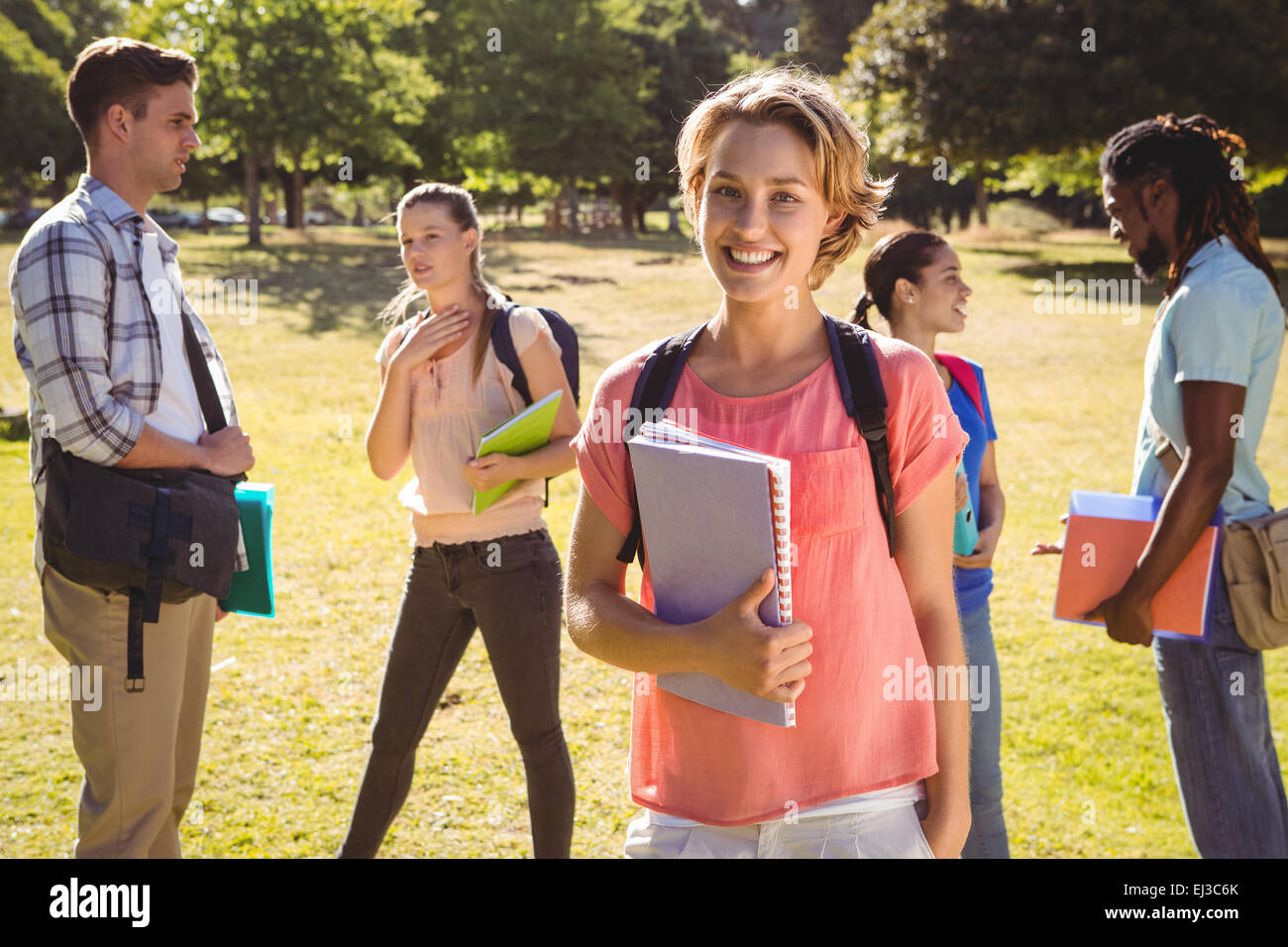 Happy students outside on campus Stock Photo - Alamy