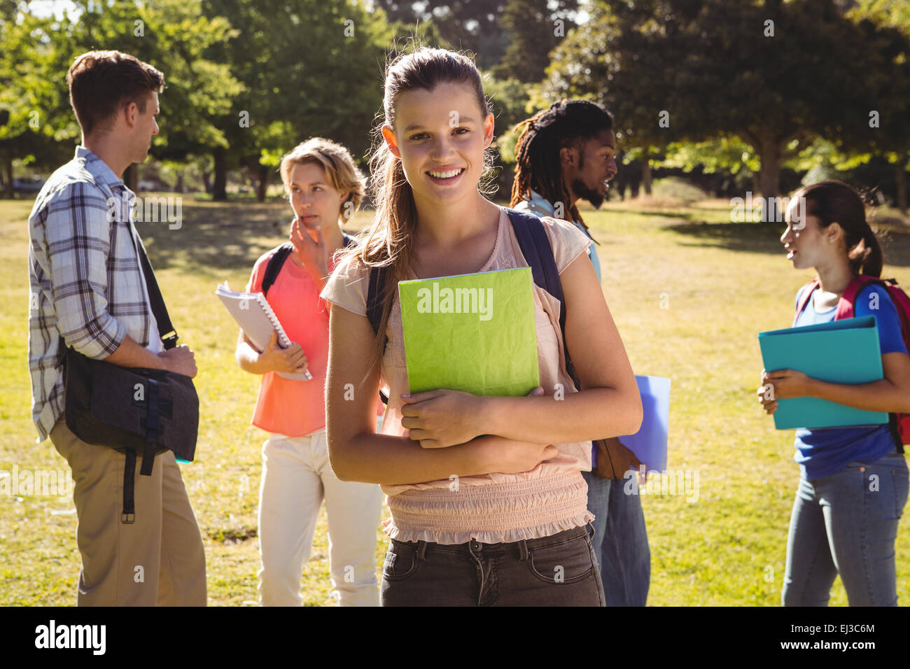 Happy students outside on campus Stock Photo - Alamy