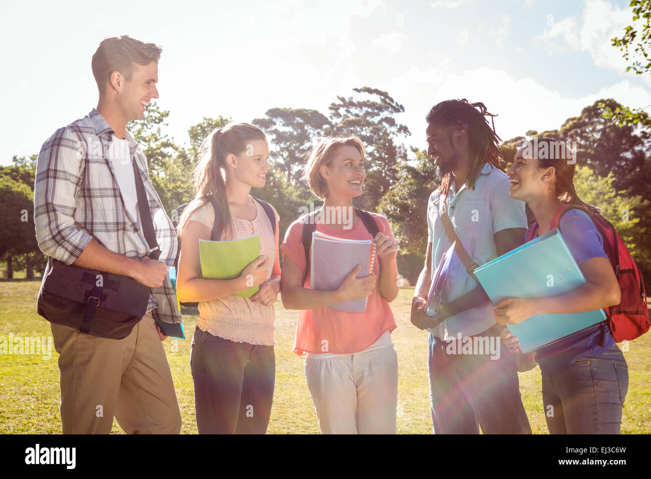 Happy students outside on campus Stock Photo - Alamy