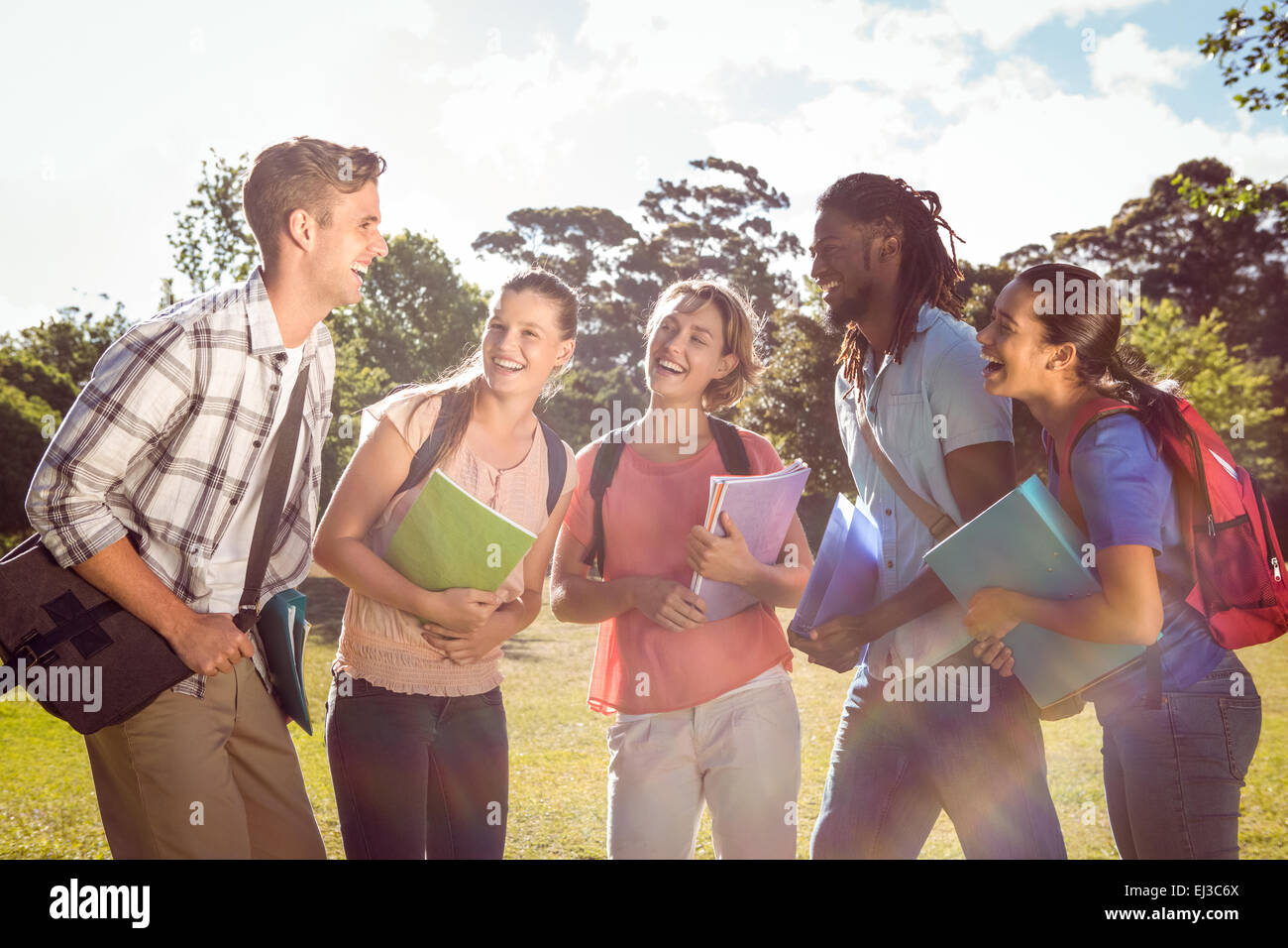 Happy students outside on campus Stock Photo - Alamy