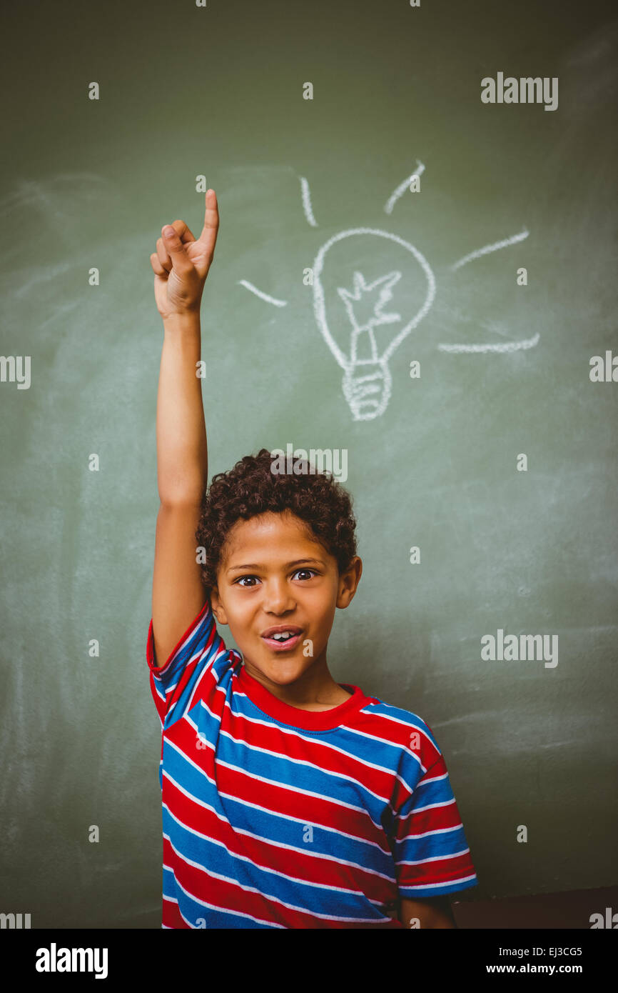 Boy raising hand in classroom hi-res stock photography and images - Alamy