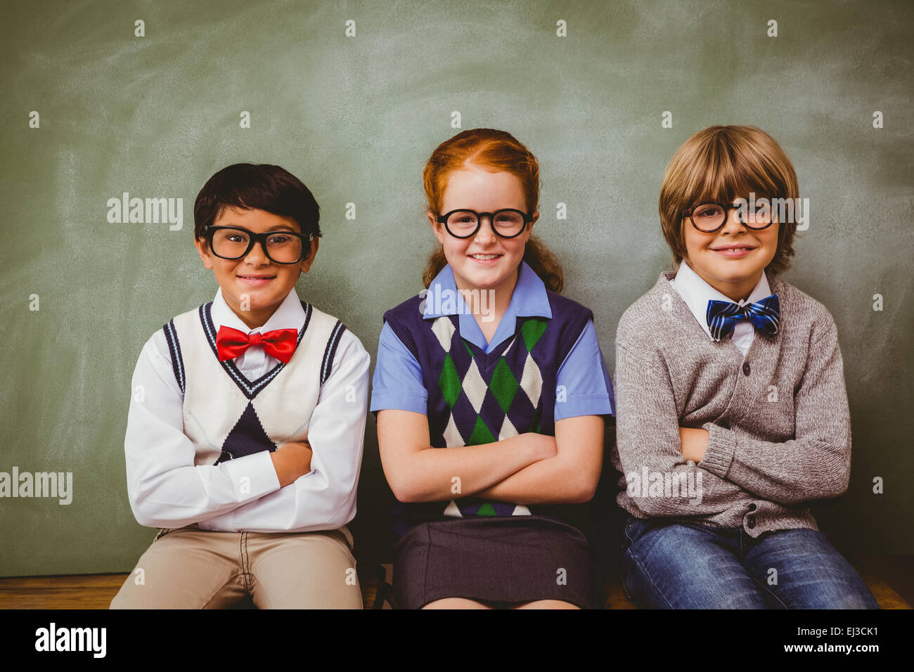 Smiling little school kids in classroom Stock Photo - Alamy