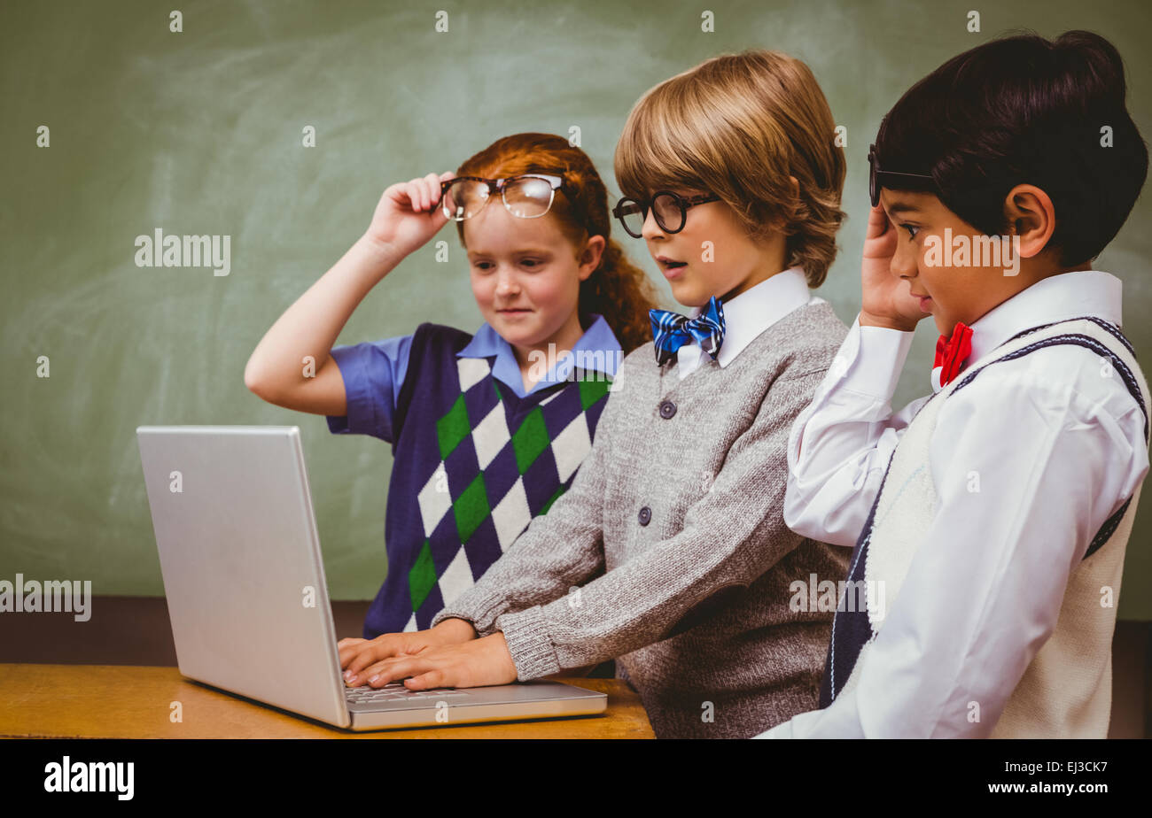 School kids using laptop in classroom Stock Photo - Alamy