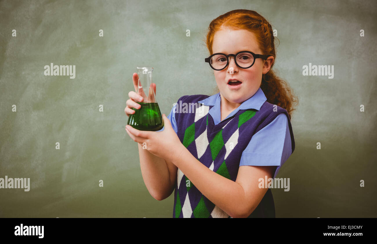 Girl holding conical flask in classroom Stock Photo - Alamy