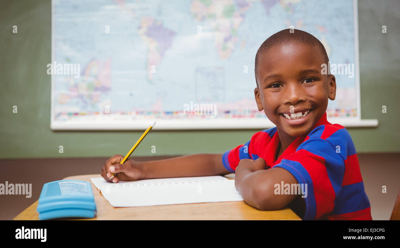 Cute boy writing in book hi-res stock photography and images - Alamy