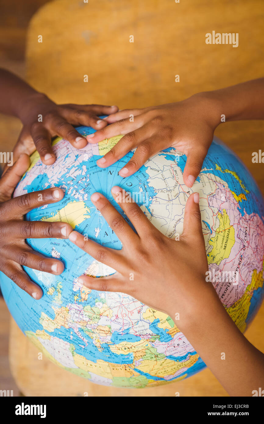 Hands touching globe hi-res stock photography and images - Alamy