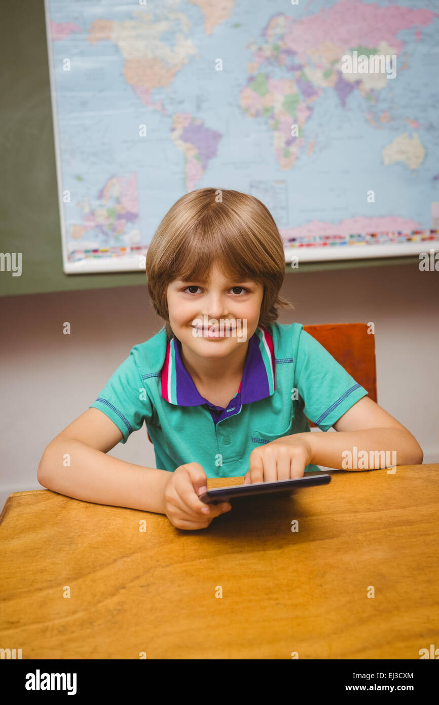 Little boy using digital tablet in classroom Stock Photo - Alamy