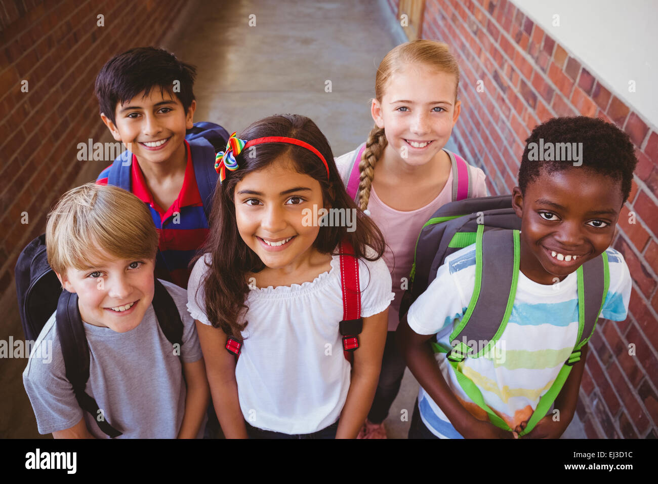 Smiling little school kids in school corridor Stock Photo - Alamy