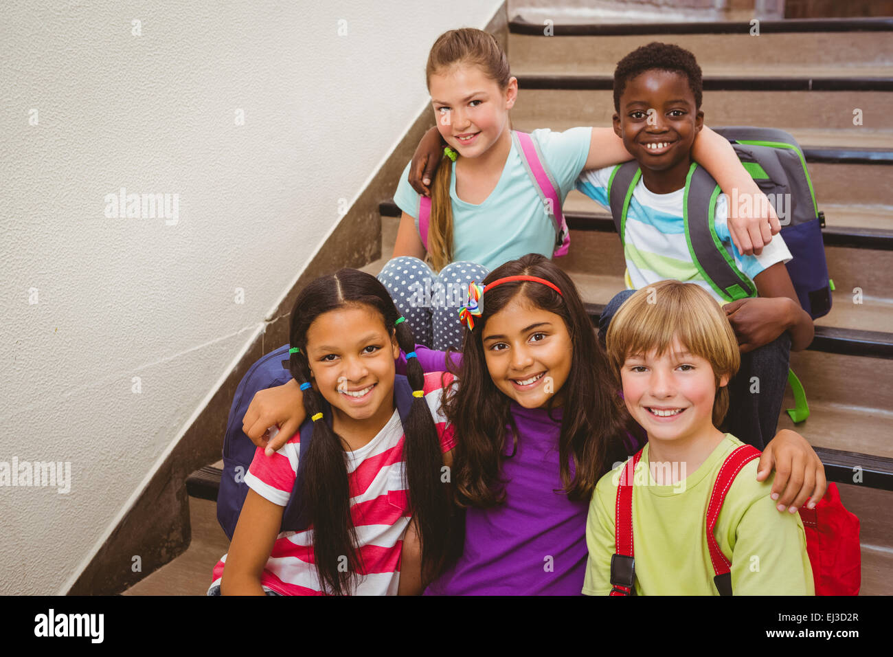 School kids sitting on stairs in school Stock Photo - Alamy