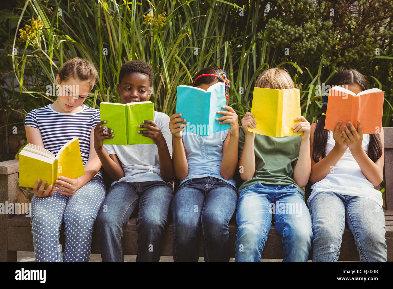 Children reading park bench hi-res stock photography and images - Alamy