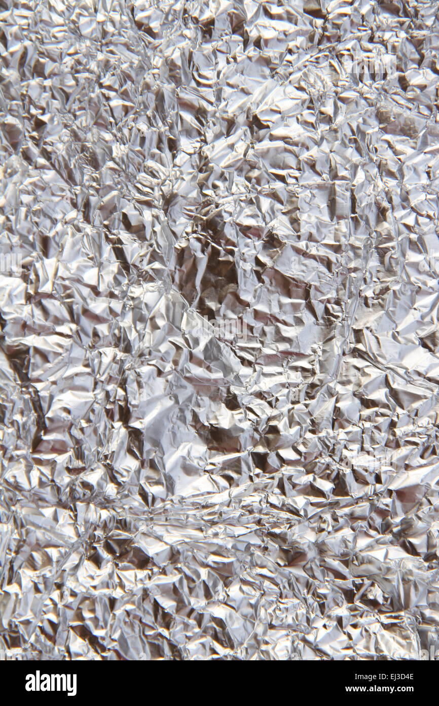 Aluminum foil curled, silver background Stock Photo - Alamy