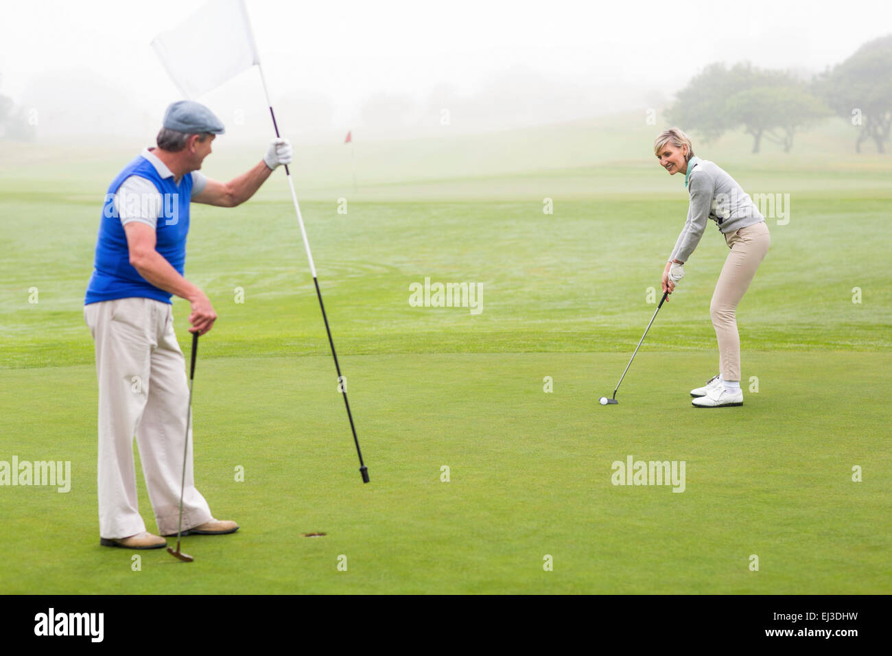 Golfing couple on golf course hi-res stock photography and images - Alamy