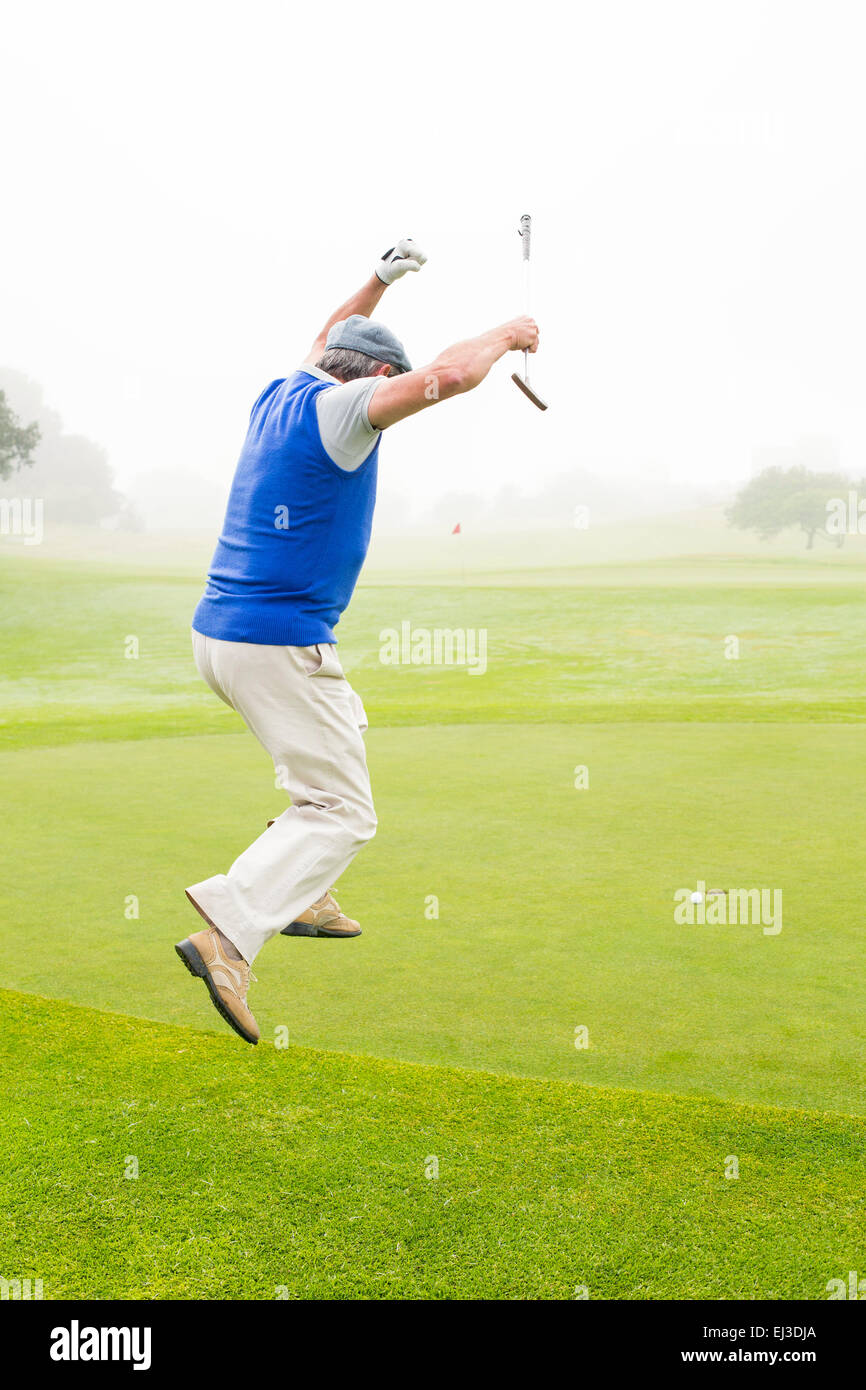 Excited golfer jumping up Stock Photo - Alamy