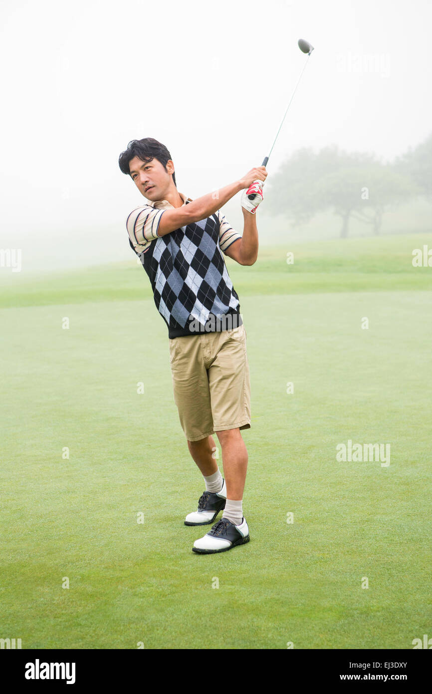 Golfer teeing off Stock Photo - Alamy Golfer teeing off Stock Photo - Alamy