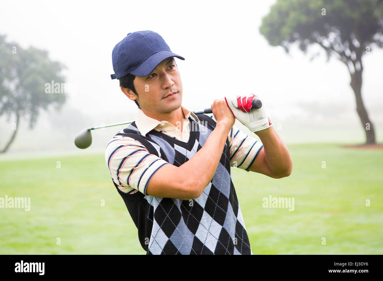 Golfer holding club on shoulder hi-res stock photography and images - Alamy