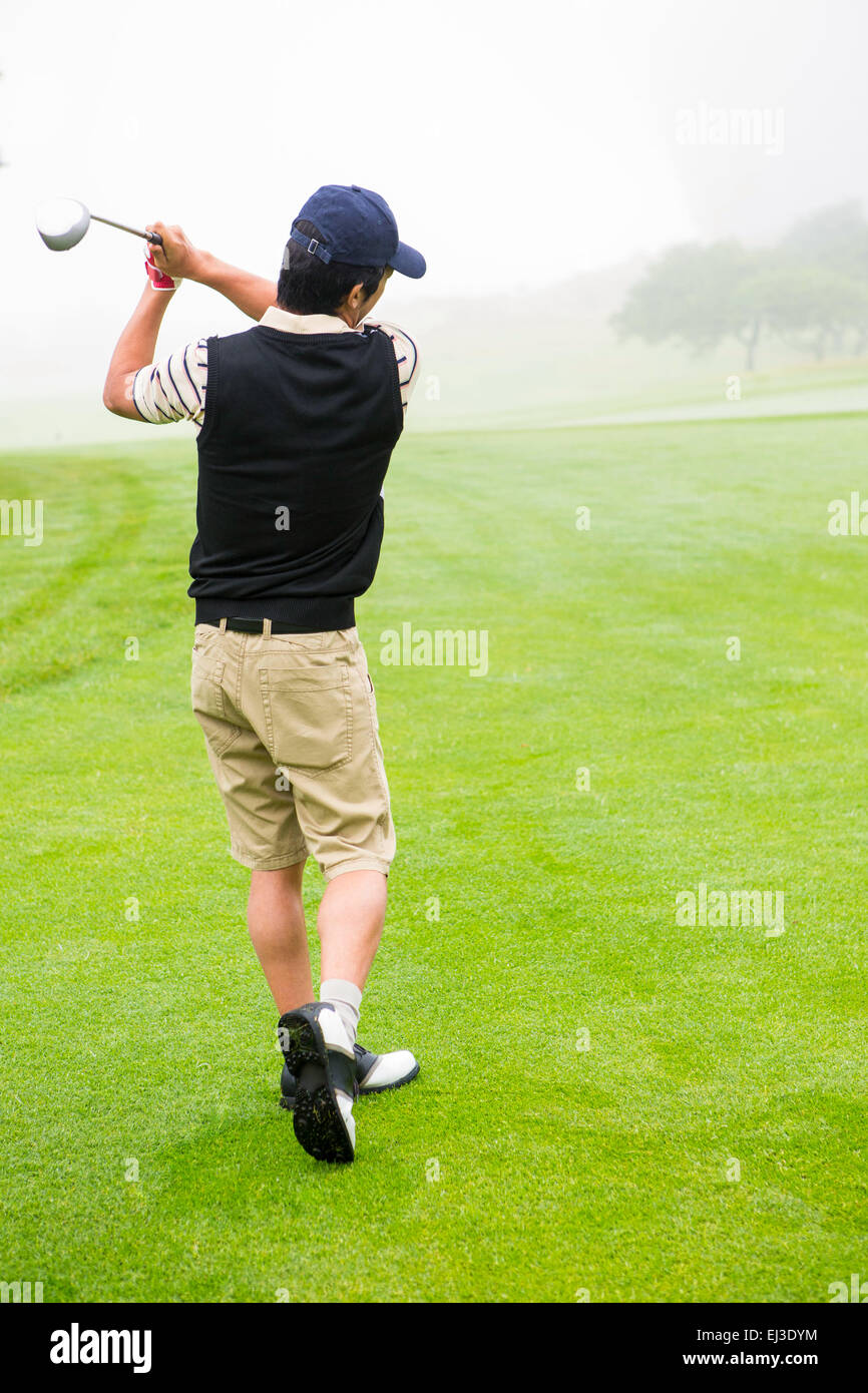 Golfer teeing off Stock Photo - Alamy Golfer teeing off Stock Photo - Alamy