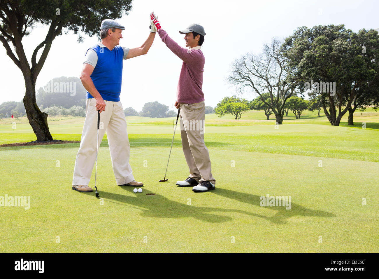 Friends high fiving hi-res stock photography and images - Alamy