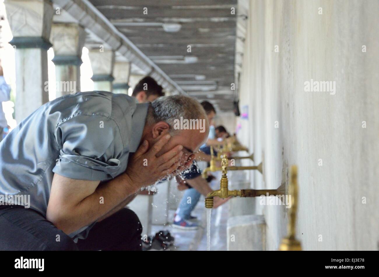 men washing themselves before praying Stock Photo - Alamy