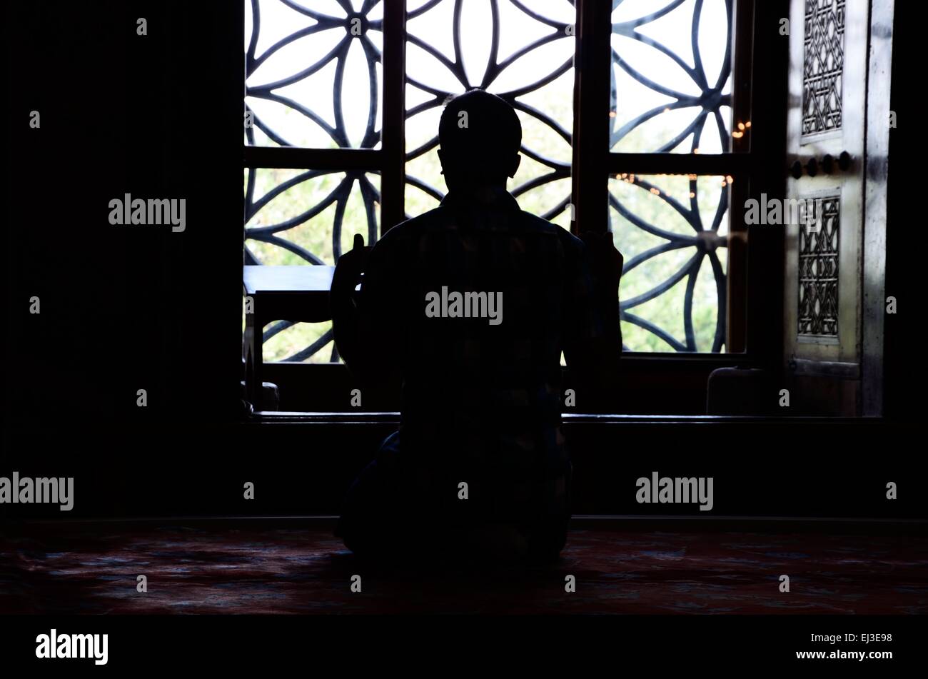 Praying shadow hi-res stock photography and images - Alamy