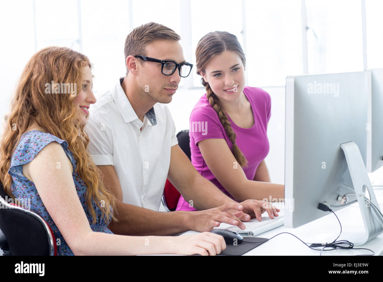 Focused students in computer class Stock Photo - Alamy