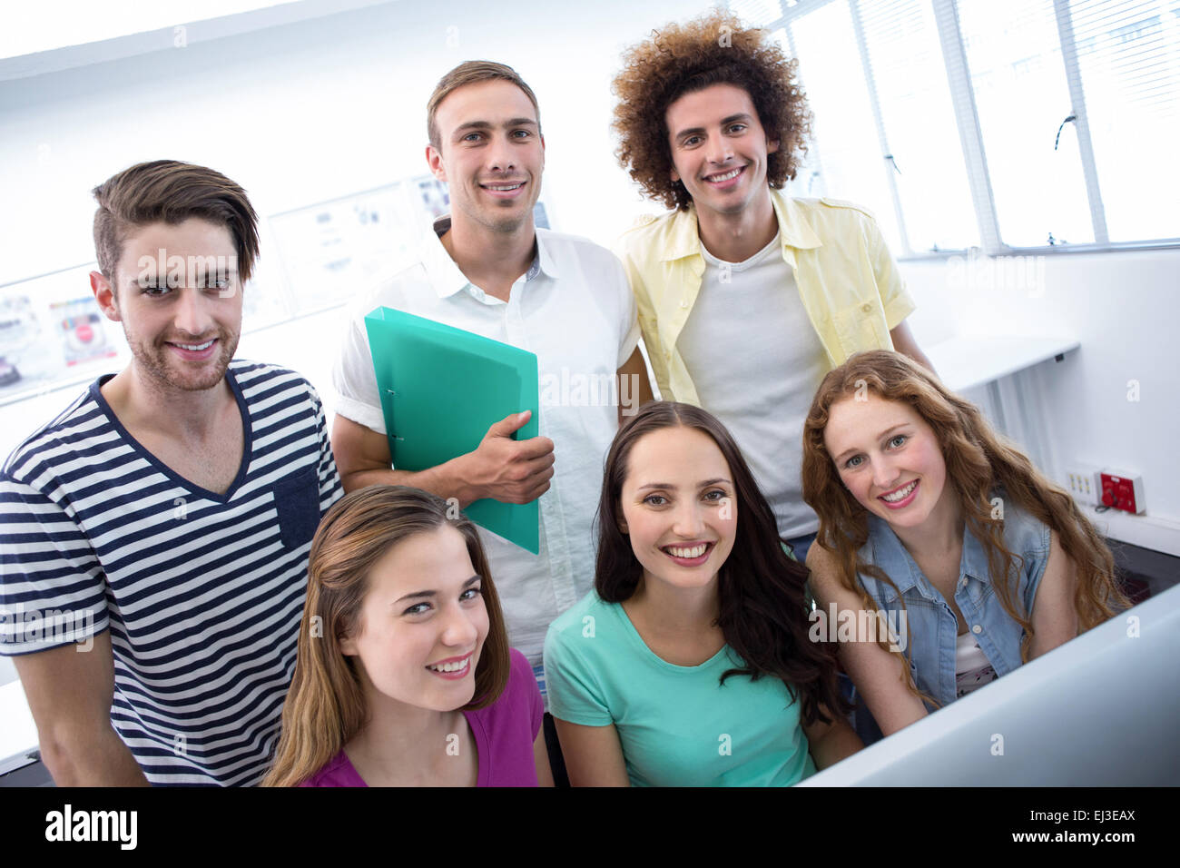 Smiling students in computer class Stock Photo - Alamy