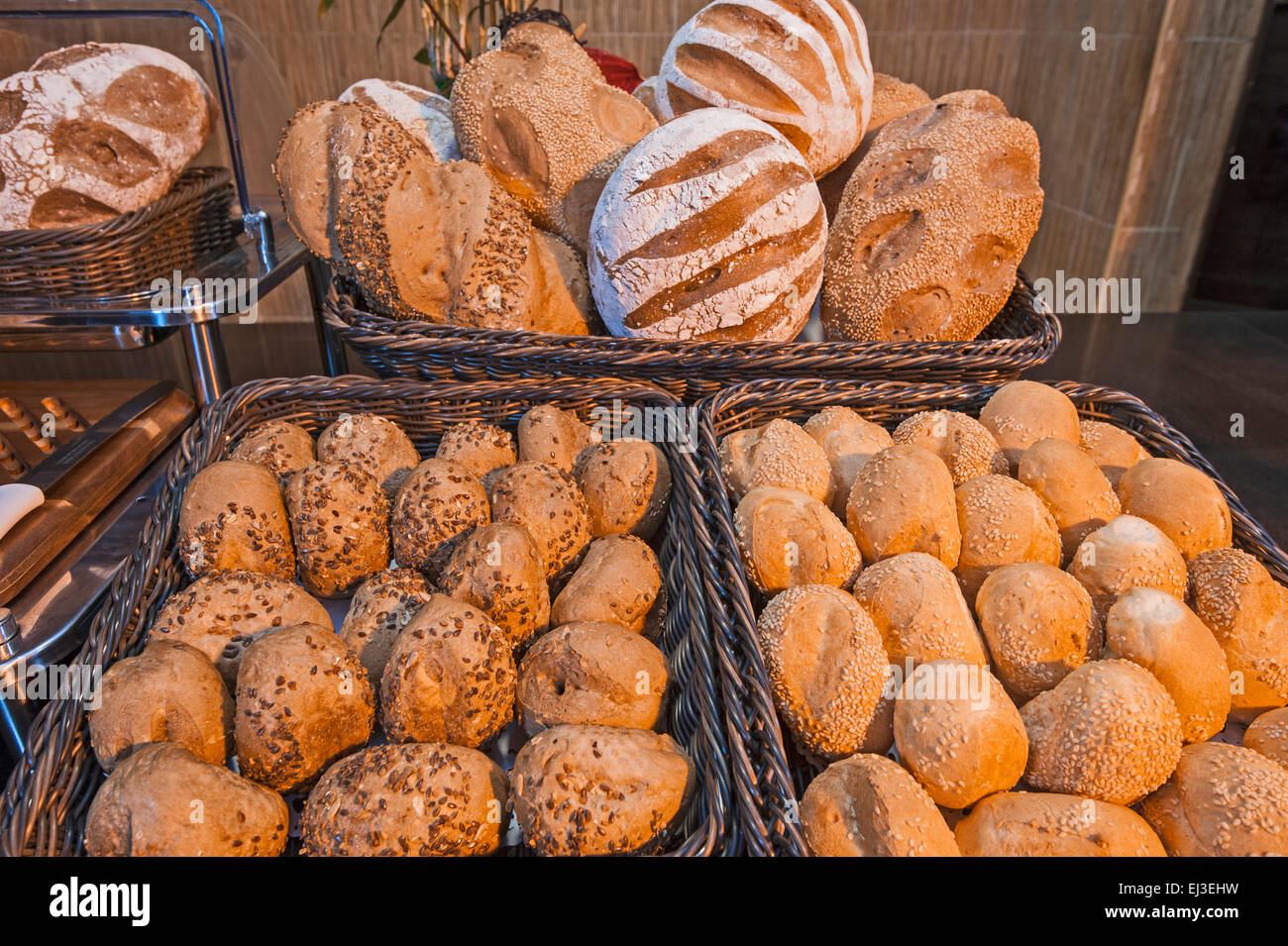 Selection of various breads in baskets at a restaurant breakfast buffet ...