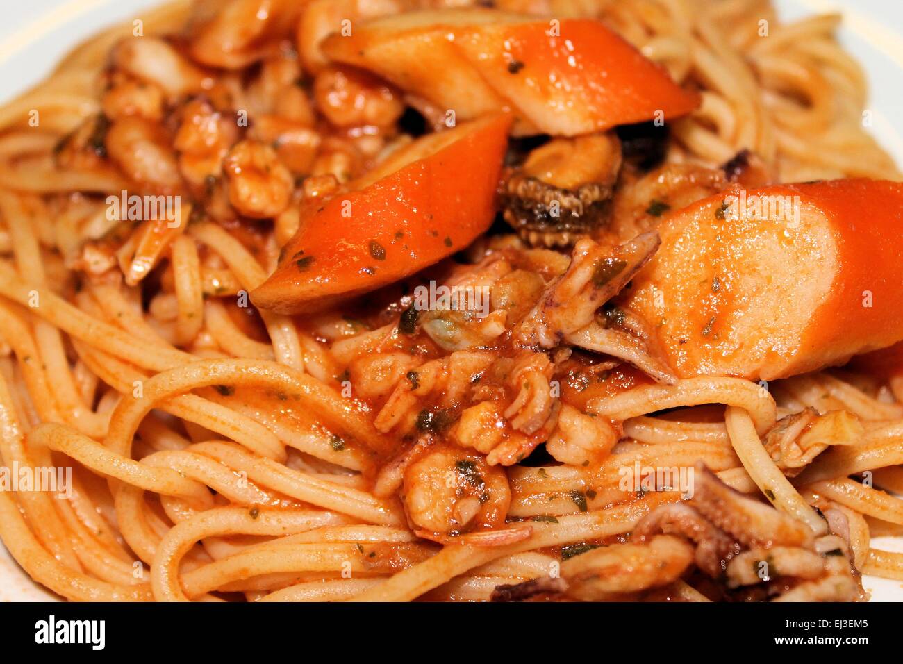 pasta spaghetti with mixed fish sauce Stock Photo - Alamy
