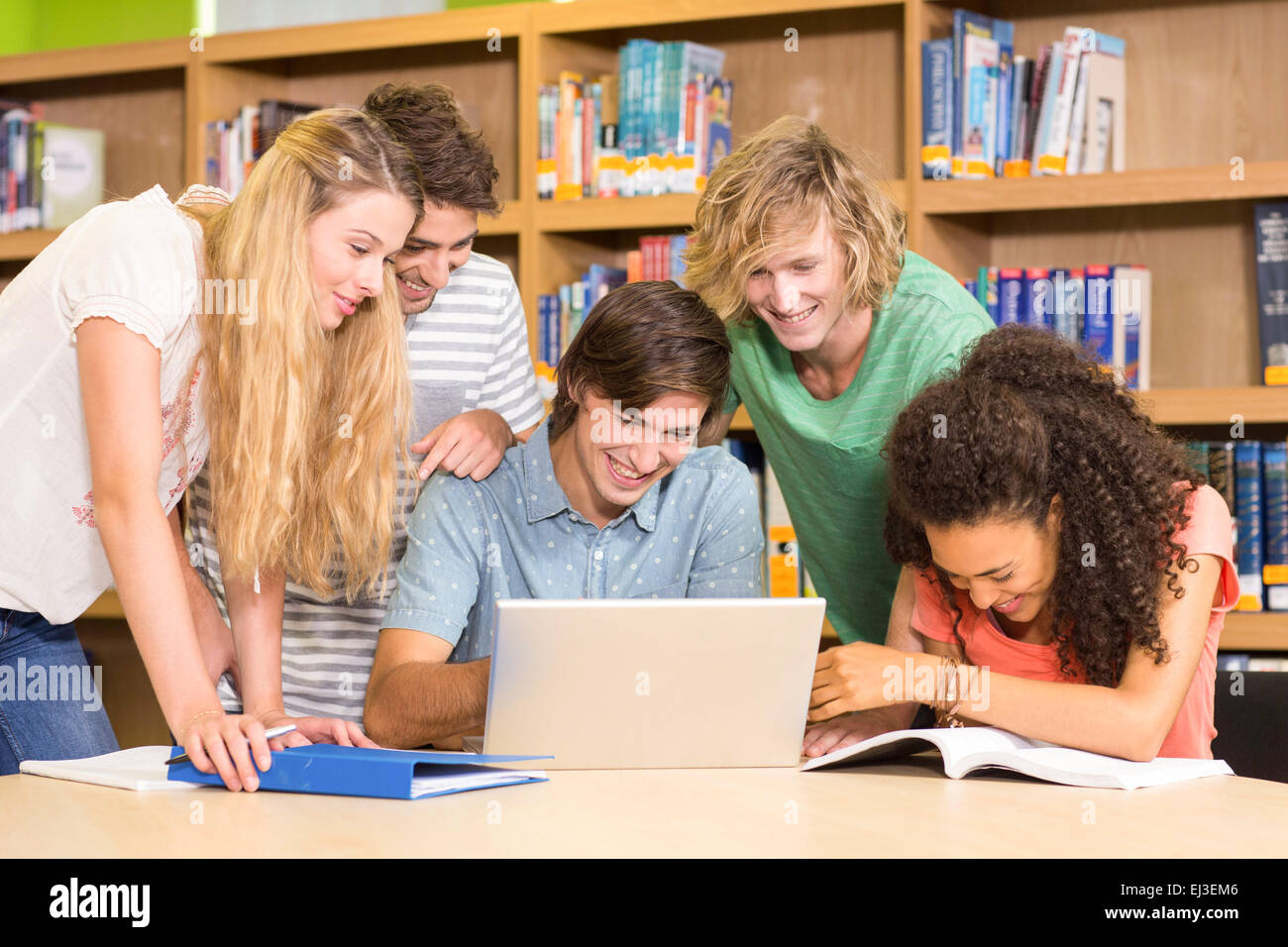 College students using laptop in library Stock Photo - Alamy