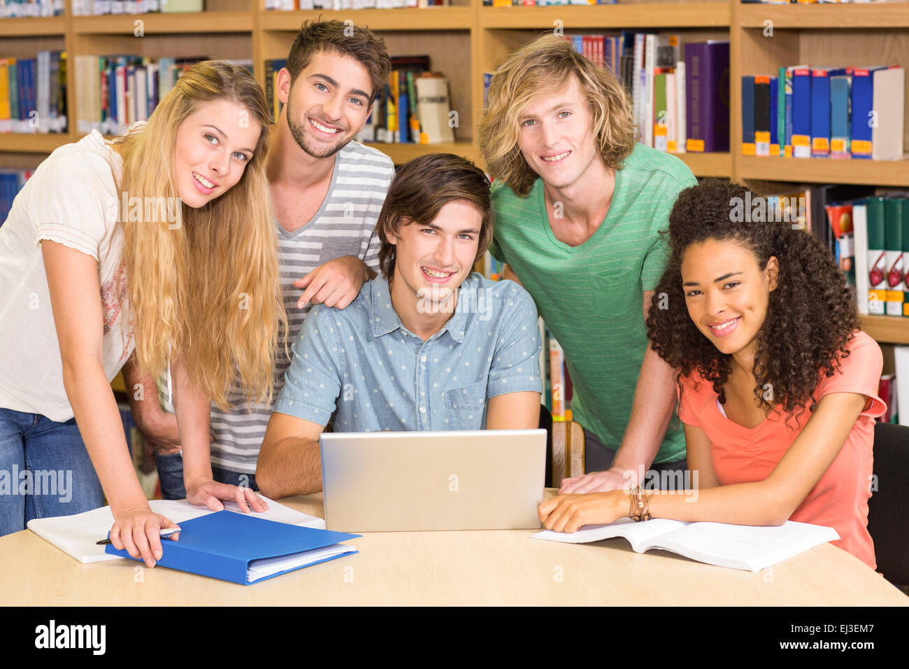 College students using laptop in library Stock Photo - Alamy
