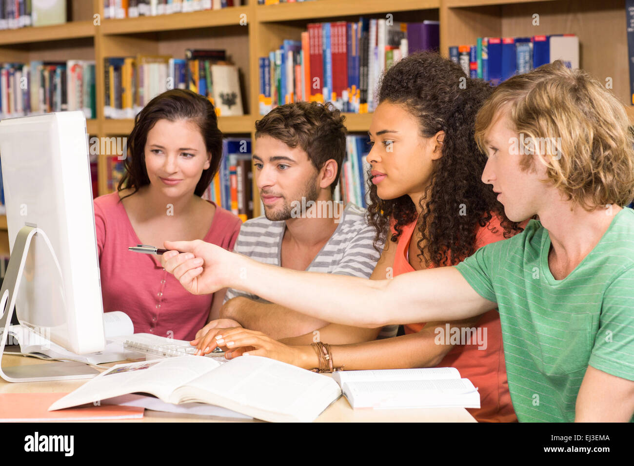 College students using computer in library Stock Photo - Alamy