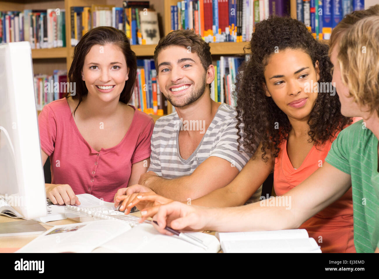 College students using computer in library Stock Photo - Alamy