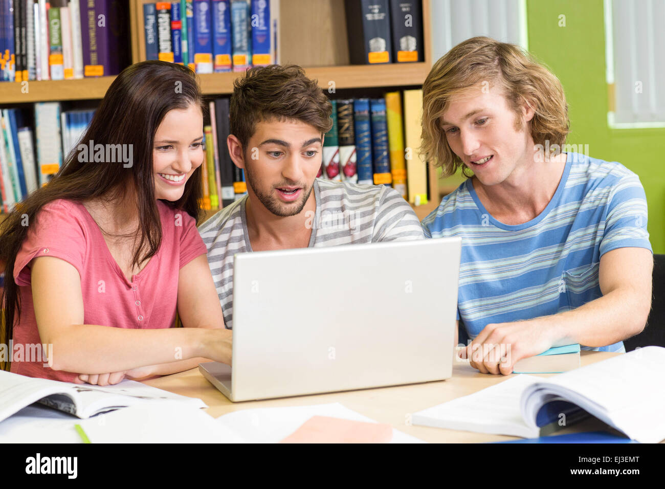 College students using laptop in library Stock Photo - Alamy