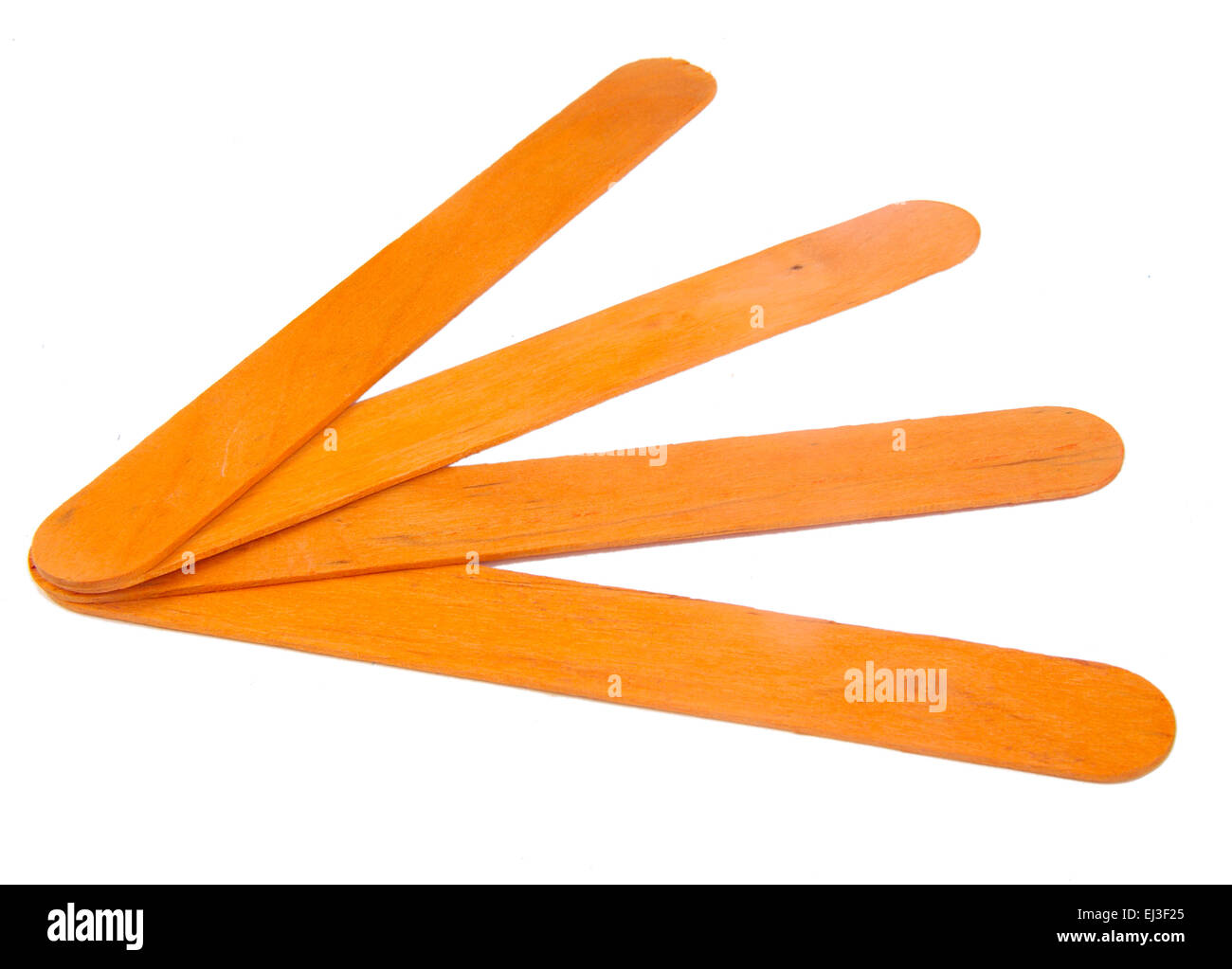 Four popsicle orange sticks for arts and crafts on white background ...