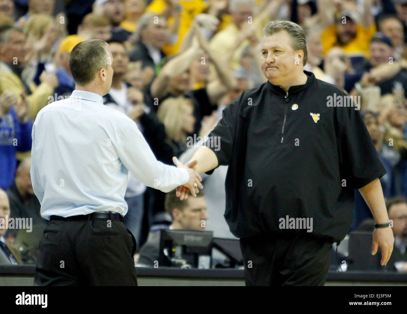 West Virginia Mountaineers head coach Bob Huggins us congratulated by ...