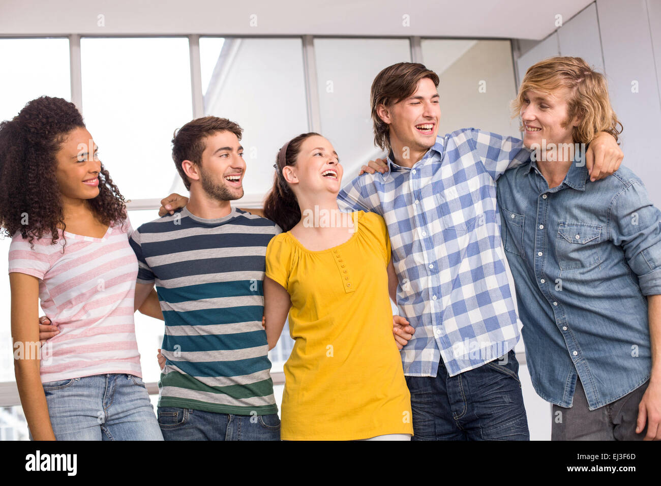 College students standing with arms around Stock Photo - Alamy