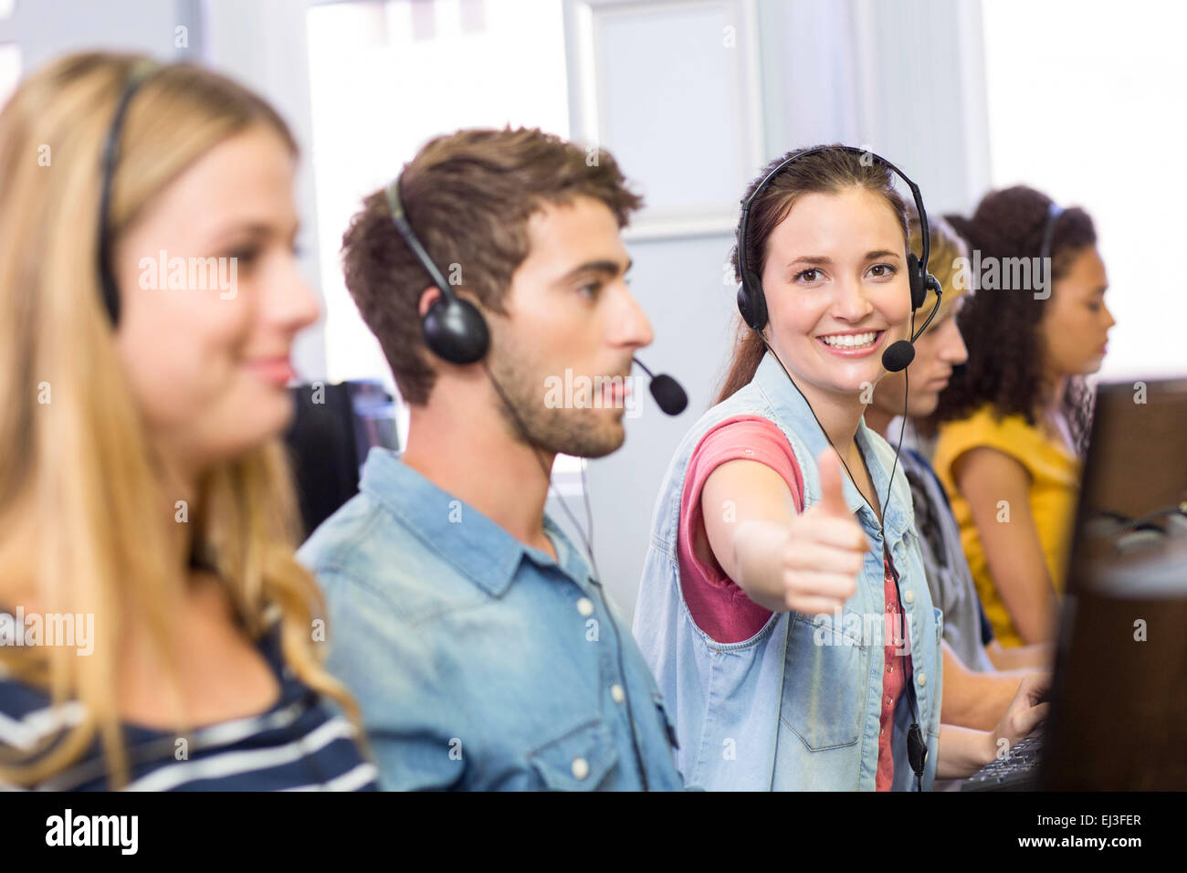 Students using headsets in computer class Stock Photo - Alamy