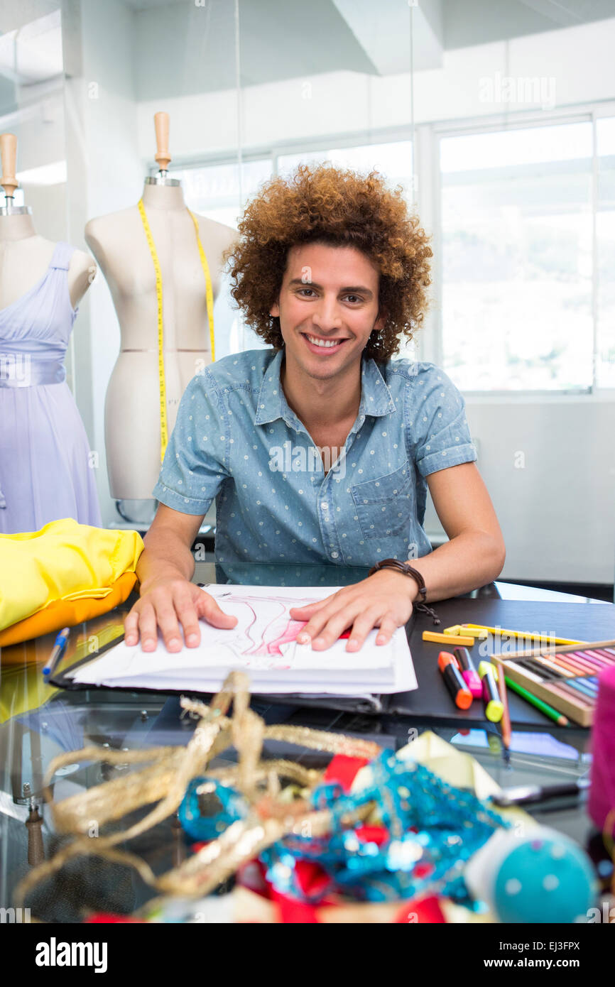 Attractive male fashion designer sketching Stock Photo - Alamy
