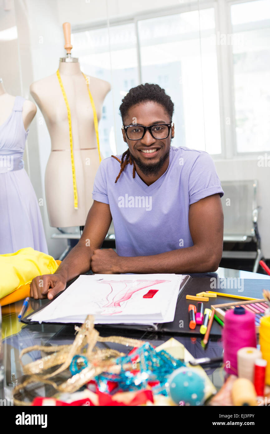 Attractive male fashion designer sketching Stock Photo - Alamy