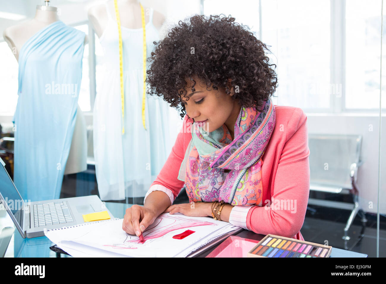Female Fashion Designer At Work