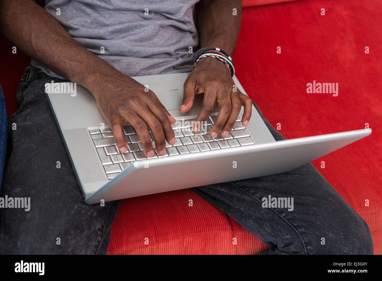 Hands using laptop Stock Photo - Alamy