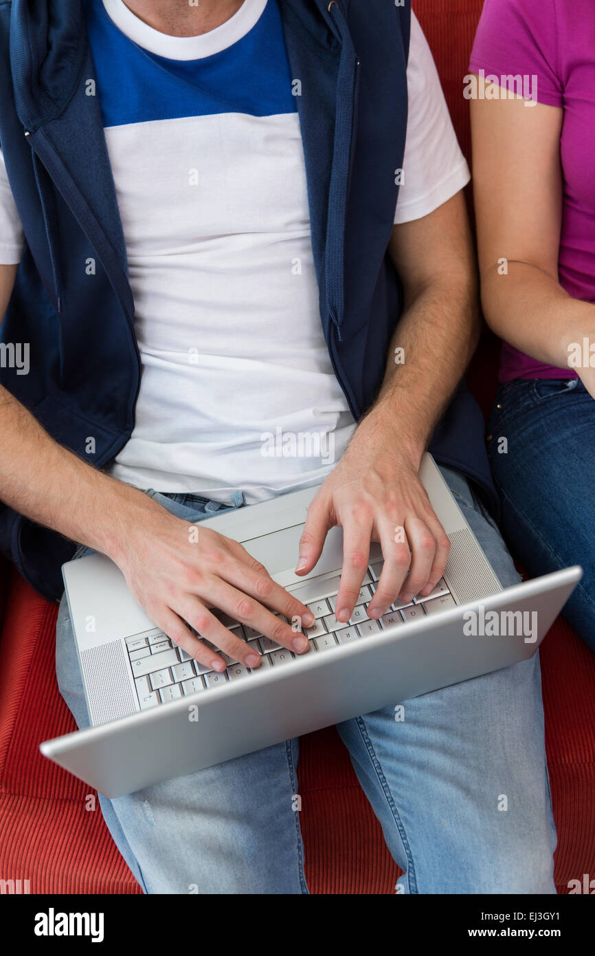 Hands using laptop Stock Photo - Alamy