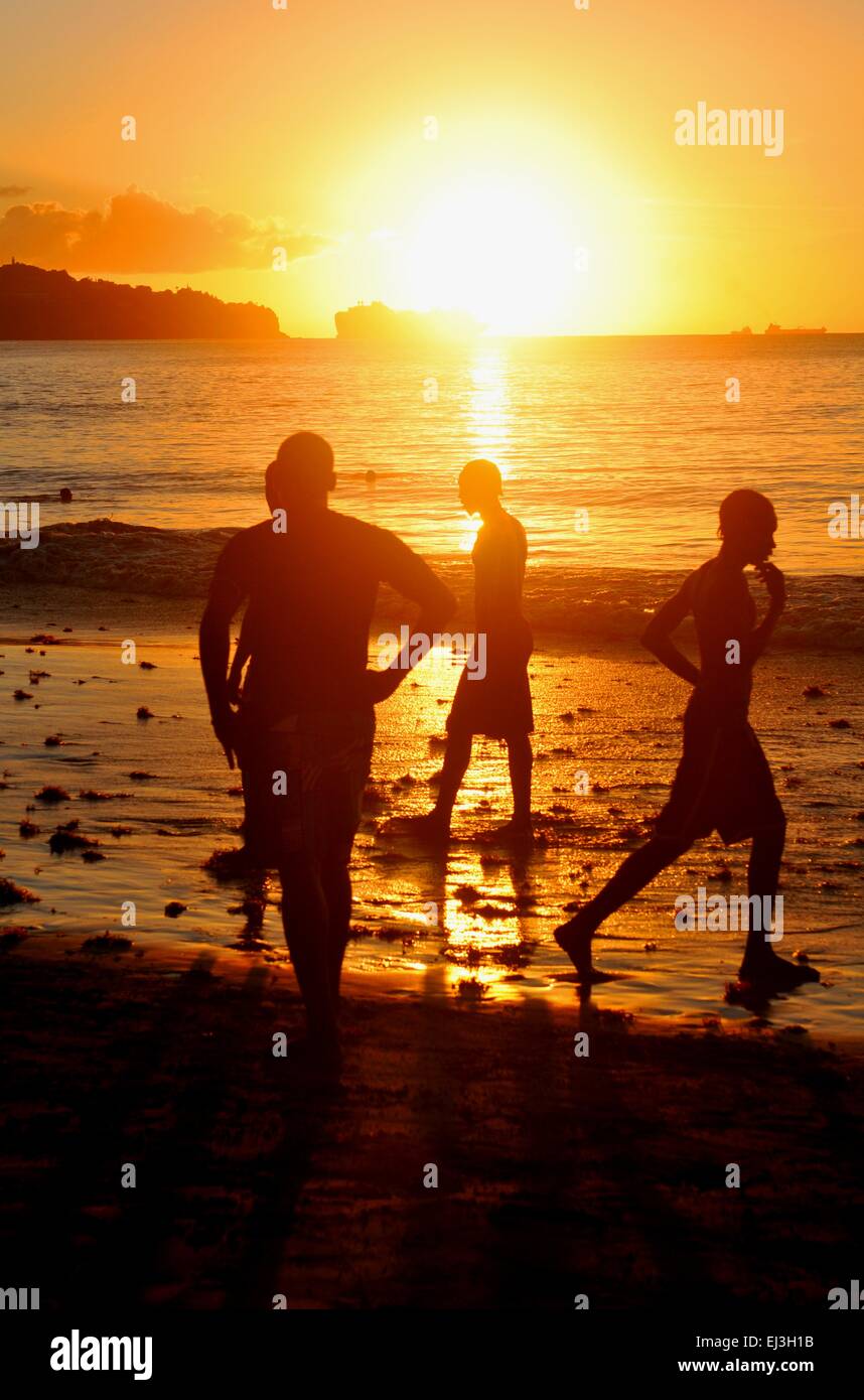 Silhouettes of people at sunset Stock Photo - Alamy