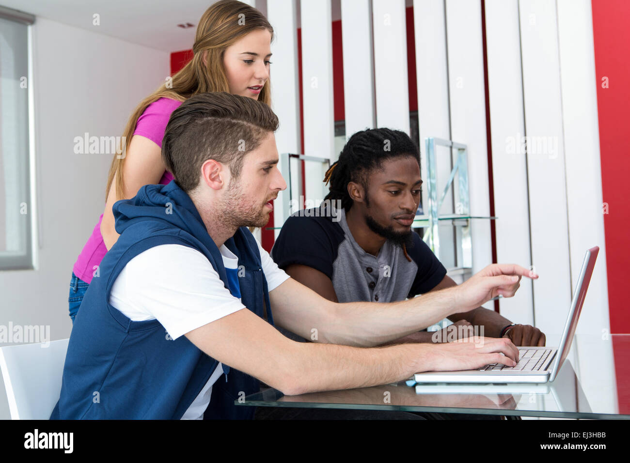 Creative team using laptop Stock Photo - Alamy