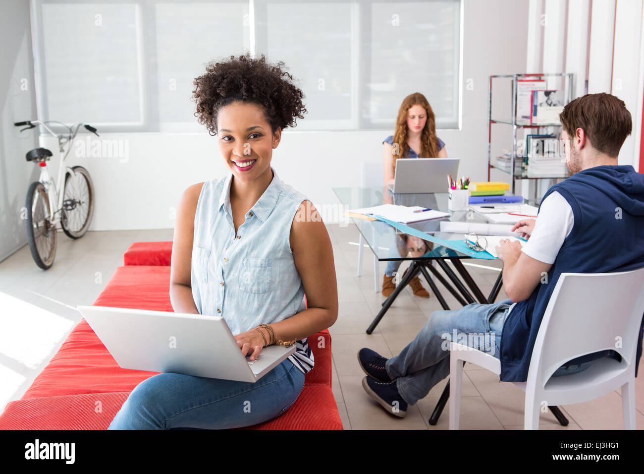 Happy creative workers laptops hi-res stock photography and images - Alamy