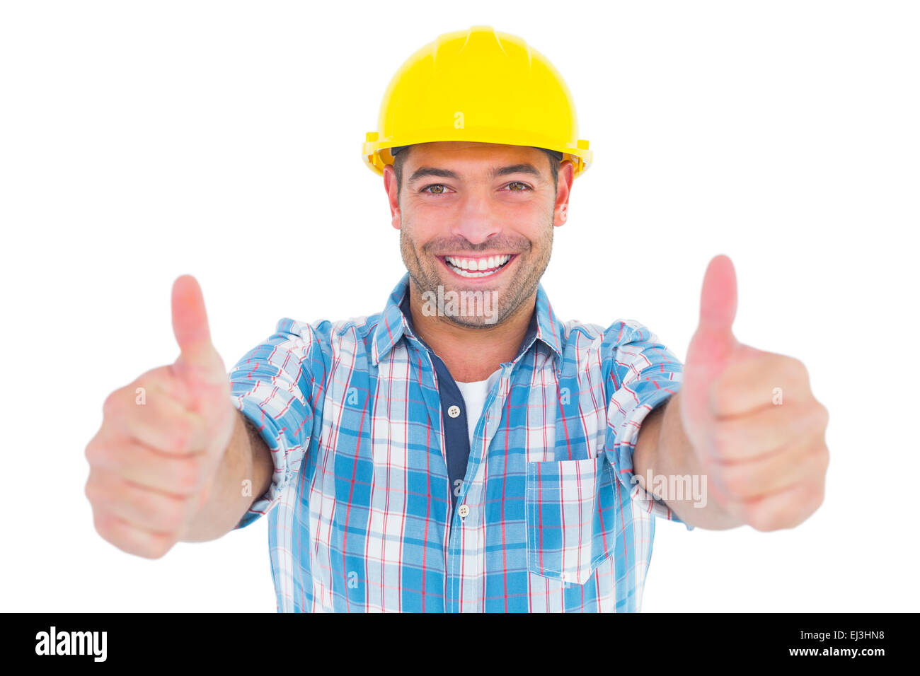 Smiling manual worker gesturing thumbs up Stock Photo - Alamy