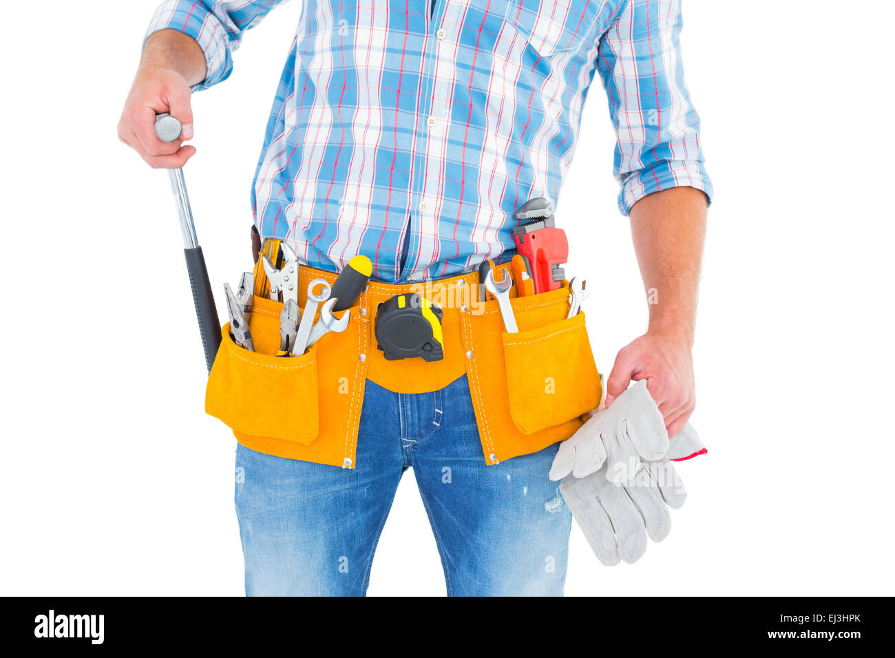 Midsection of handyman holding hammer and gloves Stock Photo - Alamy