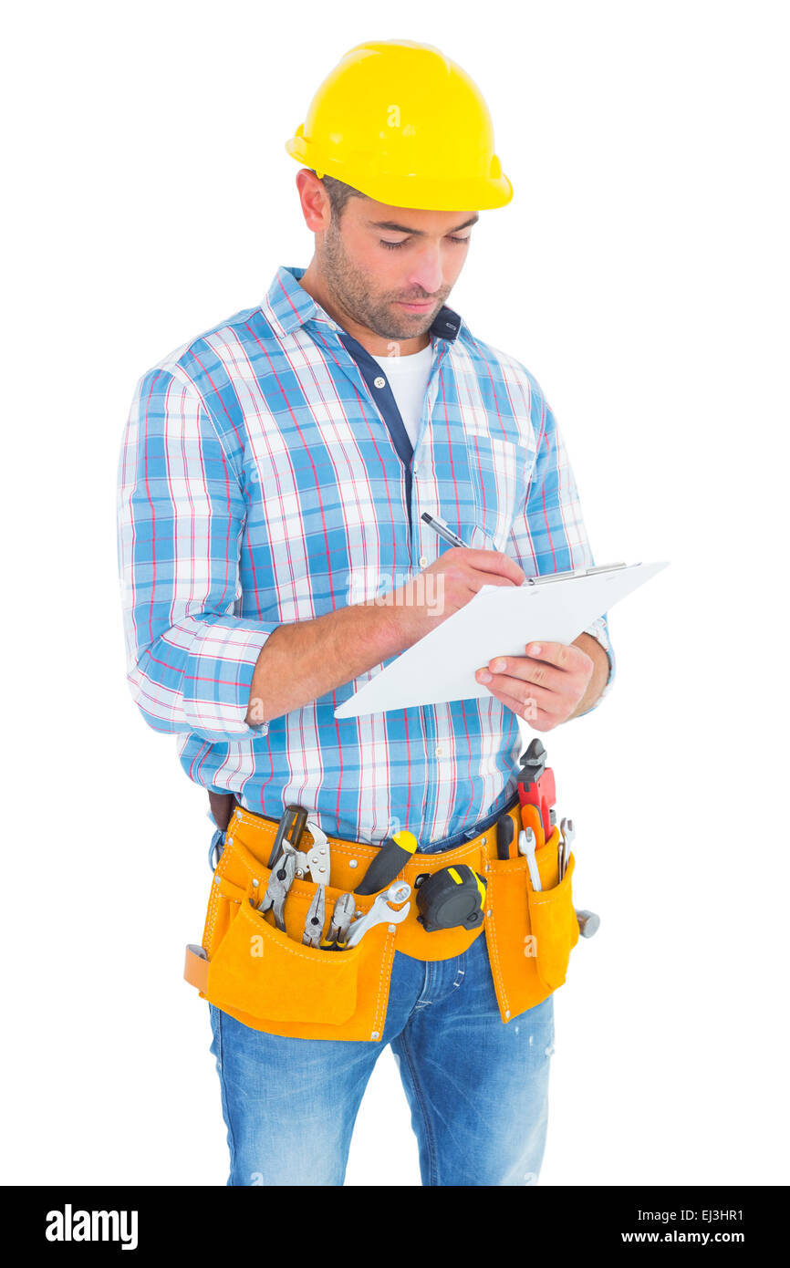 Manual worker writing on clipboard Stock Photo - Alamy