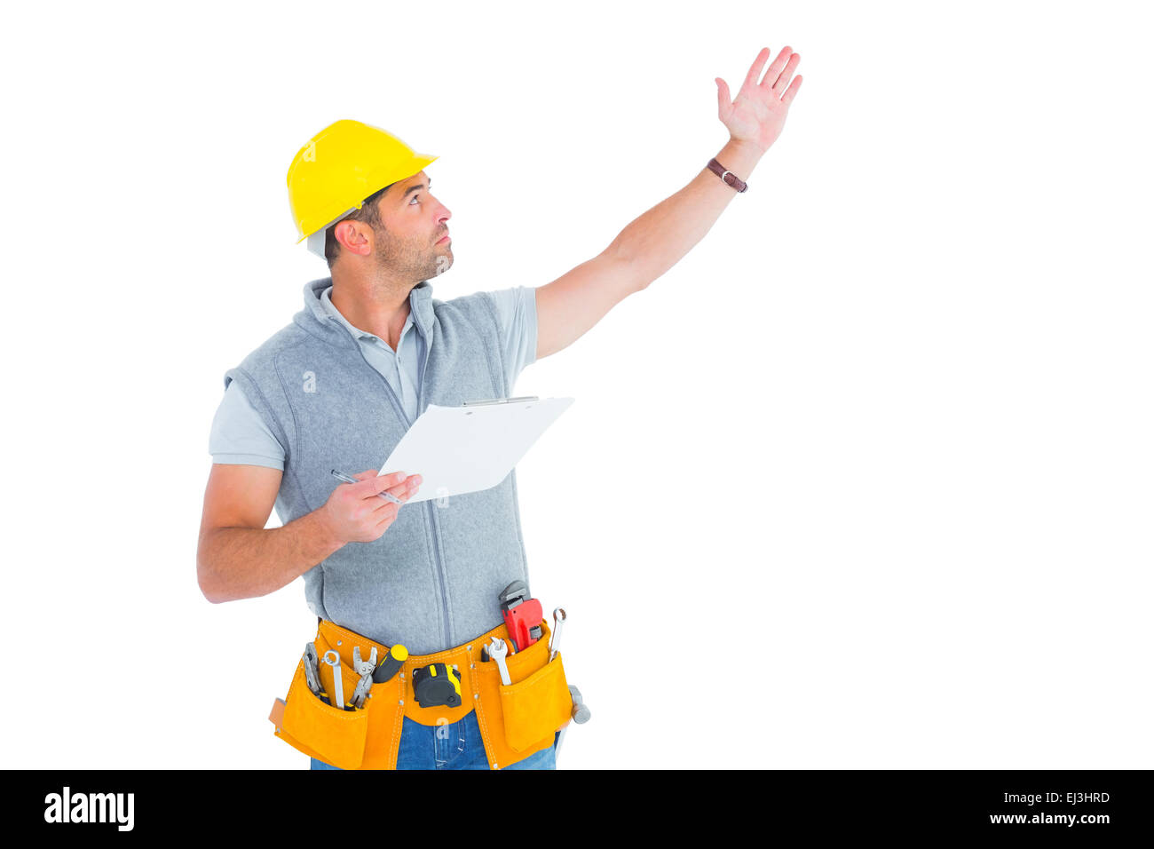 Male supervisor with hand raised holding clipboard Stock Photo - Alamy